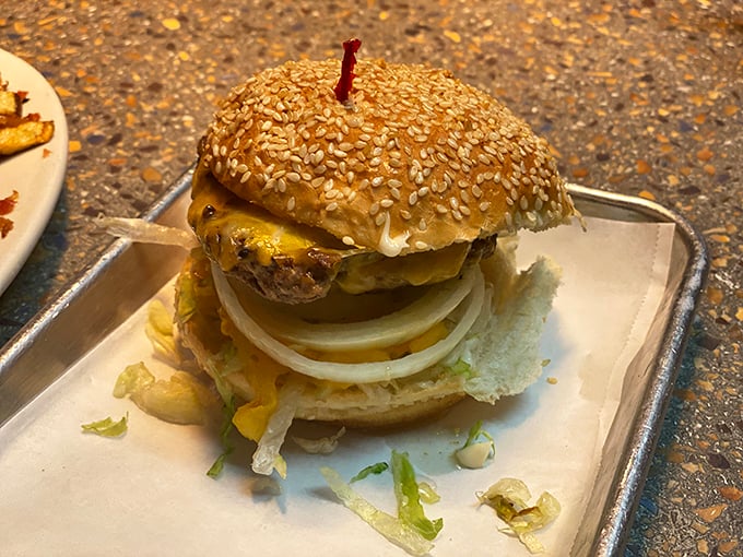 A burger that doesn't need fancy tricks—just a perfectly seared patty, melty cheese, and a sesame bun that means business.
