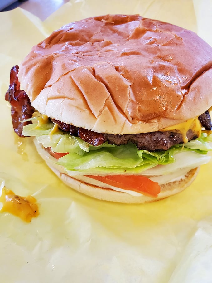 Behold the bacon cheeseburger in all its glory—where melty cheese, crisp lettuce, and a perfectly toasted bun create the holy trinity of burger perfection.