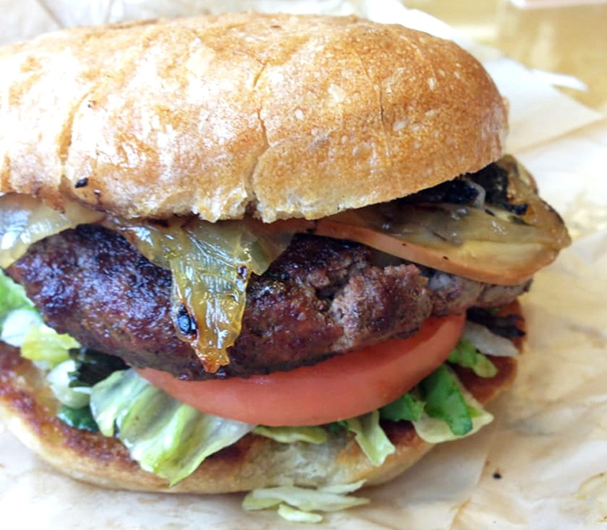 Burger architecture at its finest – where every ingredient plays its role in a symphony of savory satisfaction that speaks fluent comfort food.