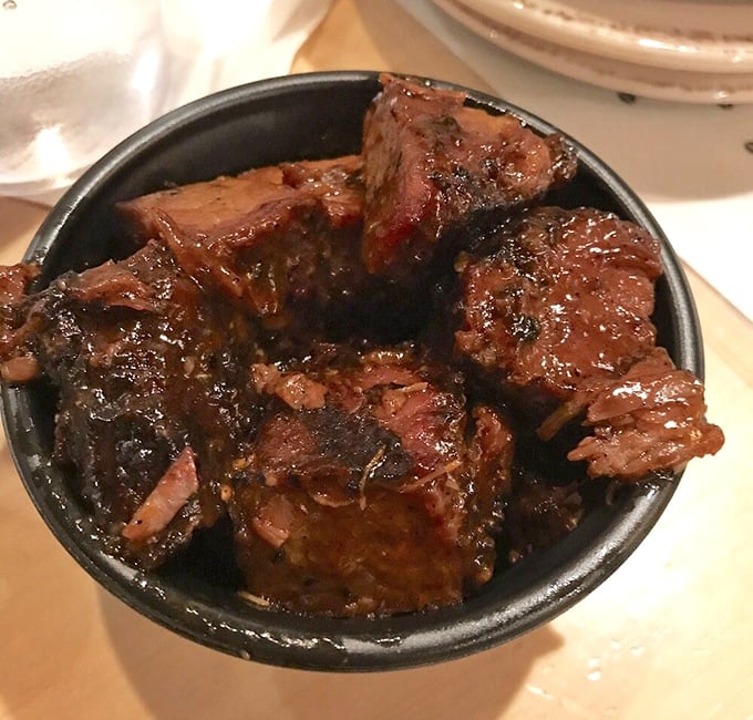 These burnt ends aren't just meat candy—they're edible time capsules capturing hours of smoke, spice, and patience in each glistening, caramelized cube.