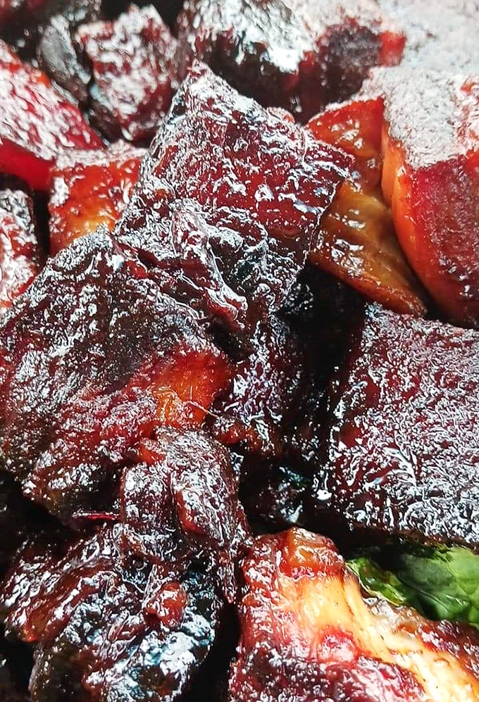 These burnt ends aren't just smoked—they're having a caramelized love affair with that glaze. Napkins required, regrets impossible.