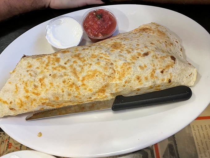The Burrito Buster isn't just a breakfast wrap – it's a tortilla fortress protecting a treasure of eggs, cheese, and savory fillings from fork-wielding invaders.
