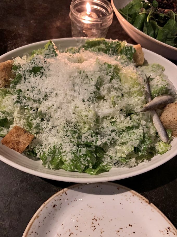 This isn't your sad desk lunch Caesar—it's a mountain of crisp romaine under a snowfall of Parmesan that would make Julius himself weep with joy.