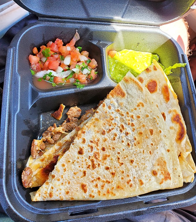 This quesadilla isn't just a meal, it's an event—perfectly grilled tortilla revealing a treasure of meat and fresh pico de gallo.