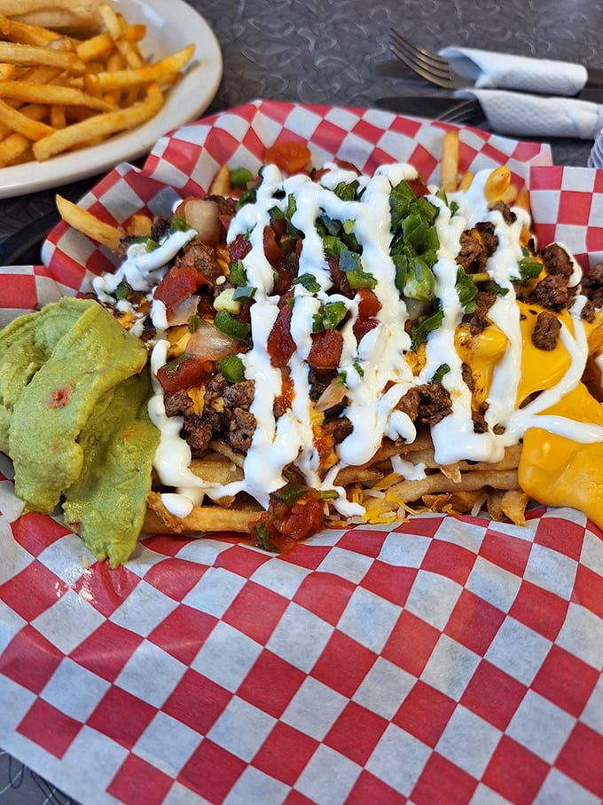 Loaded fries that don't mess around—topped with enough cheese, meat, and sauce to make you consider using a fork. Almost.