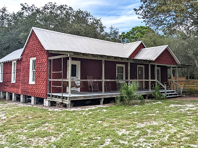 This crimson cottage with its wraparound porch whispers stories of Cedar Key's past—like a Southern grandma ready to share her secrets.