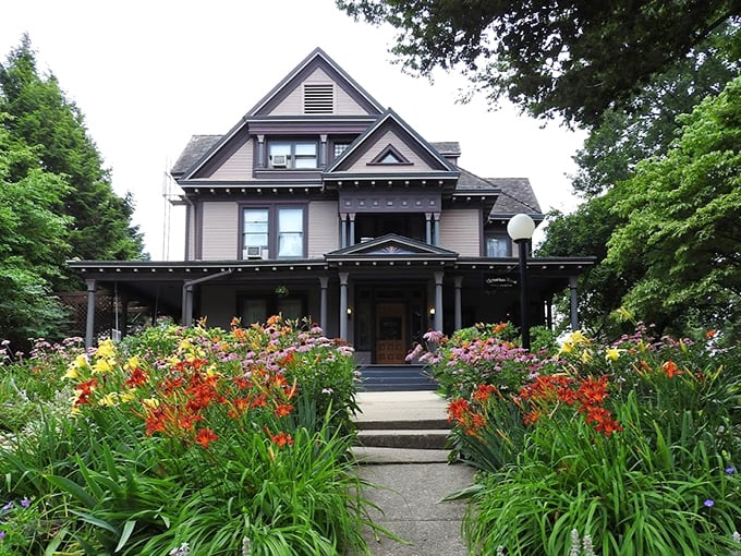 This Victorian beauty flaunts its garden like I flaunt my knowledge of pasta shapes – with unabashed enthusiasm and colorful variety.