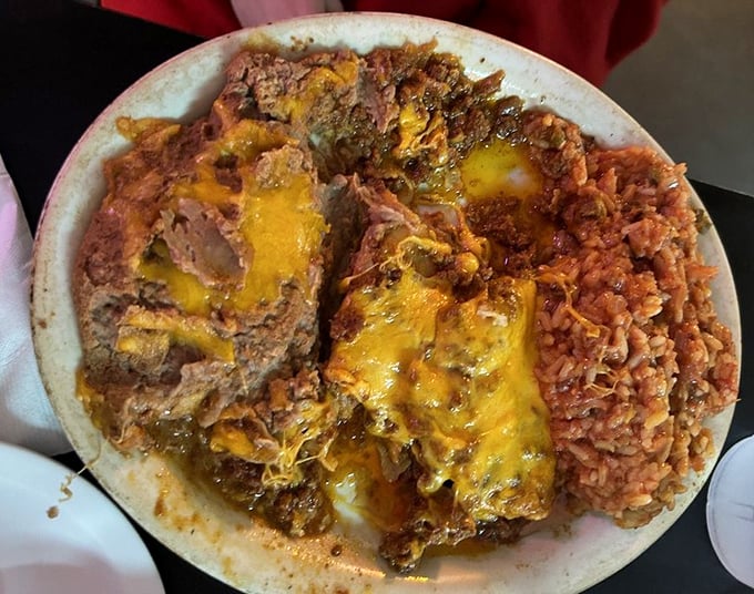 These cheese enchiladas don't just satisfy hunger—they solve existential crises. The rice isn't a side; it's a supporting actor deserving its own award.