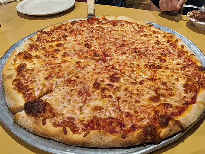 The star of the show! This cheese pizza isn't just food—it's edible geometry where every triangle equals pure happiness.