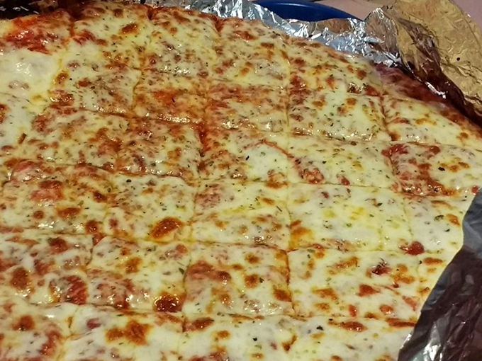 Behold the cheese pizza in all its molten glory—a perfect canvas showcasing Joe's commitment to fundamentals before any toppings steal the spotlight.