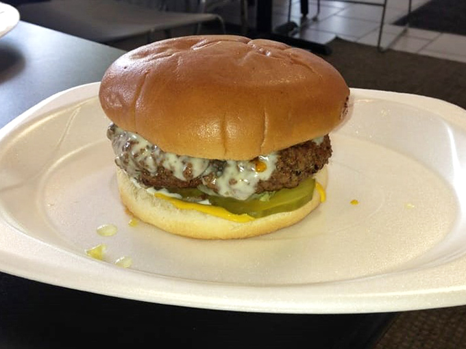 Behold the star of the show – a perfectly melty cheeseburger that makes fancy $30 restaurant versions seem like overpriced imposters. This is burger nirvana, pure and simple.
