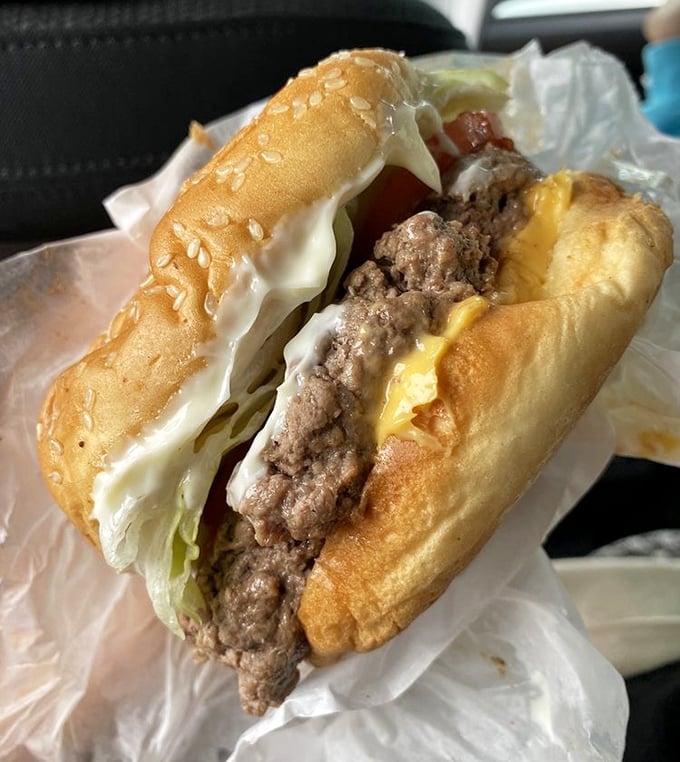 Behold the star attraction: a cheeseburger that makes fancy $20 downtown versions seem like overpriced imposters. Pure Michigan magnificence between buns.