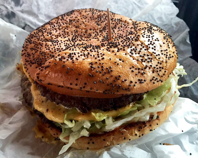 Poppy seed bun, fresh lettuce, special sauce—this isn't just lunch, it's a masterclass in burger architecture that puts modern gourmet versions to shame.