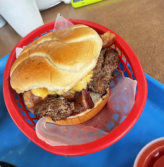 Behold the Chapman Burger in all its glory – where beef, ham, and cheese unite in a holy trinity of flavor that'll haunt your dreams.