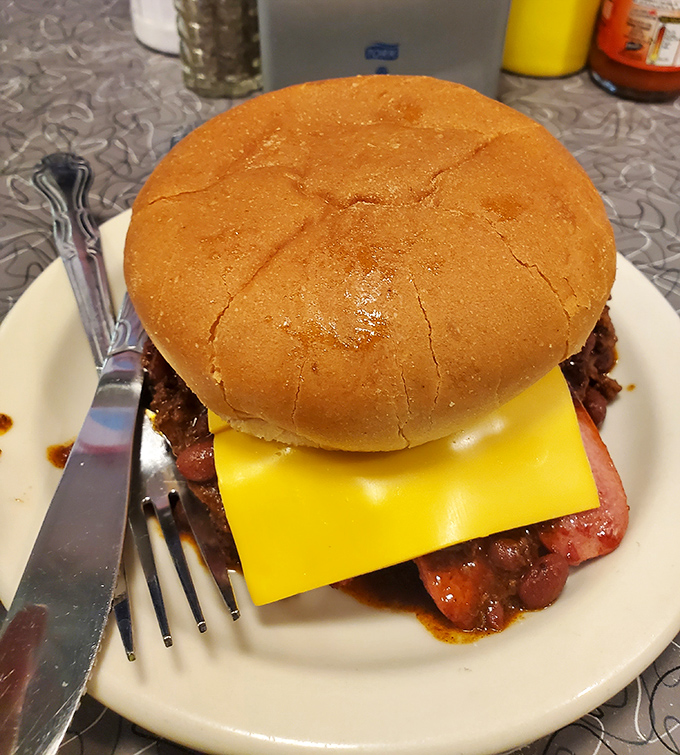 This isn't just a cheeseburger – it's edible nostalgia, with American cheese melting into a perfectly griddled patty on a toasted bun.