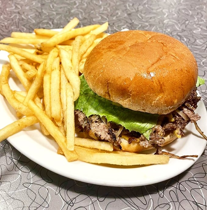 This isn't just a cheeseburger and fries—it's edible poetry on a plate. The kind of simple perfection that makes you question why anyone would complicate food.
