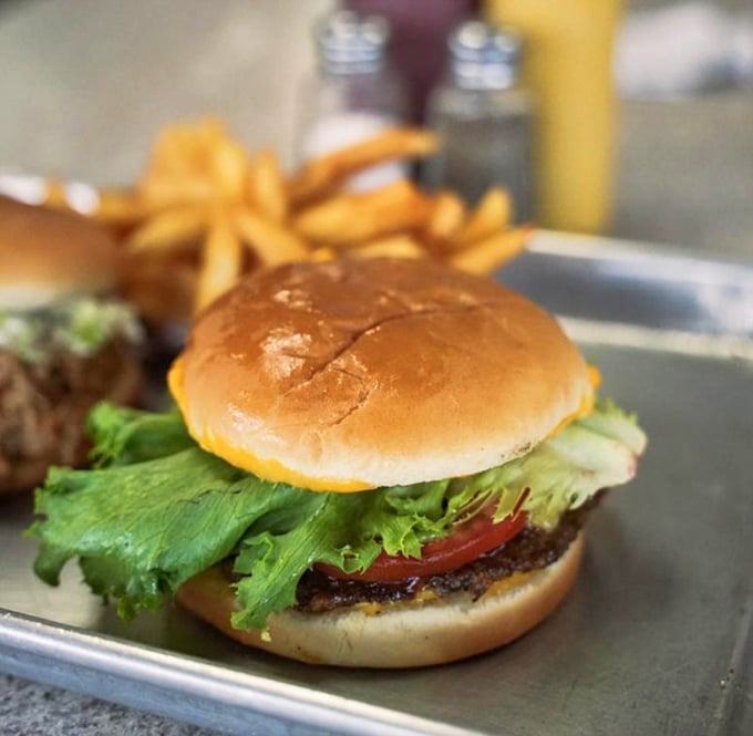 Behold the star of the show—a cheeseburger that doesn't need truffle aioli or artisanal anything to be absolutely magnificent.