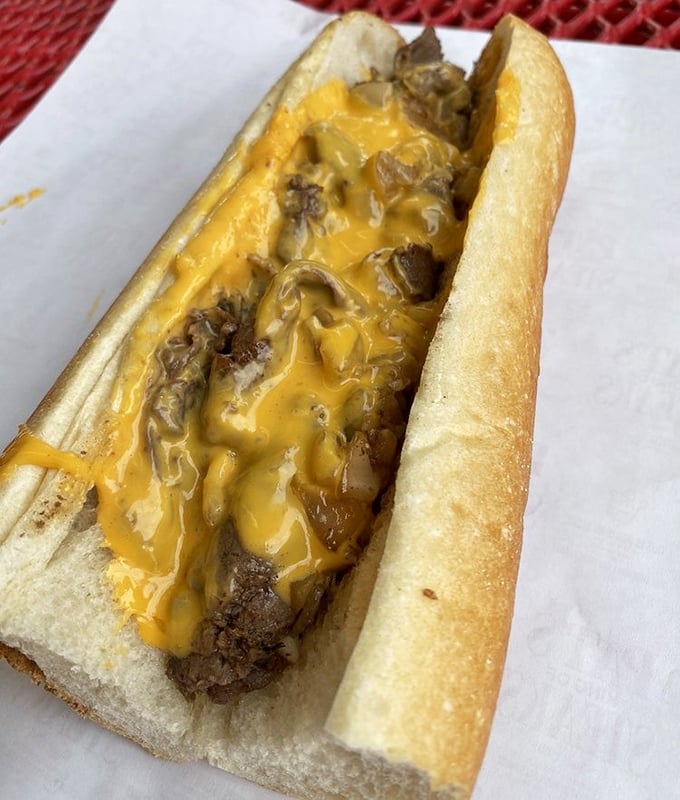 Behold the Whiz wit! That golden cascade of cheese isn't just a topping—it's a Philadelphia birthright melting into perfectly chopped steak.
