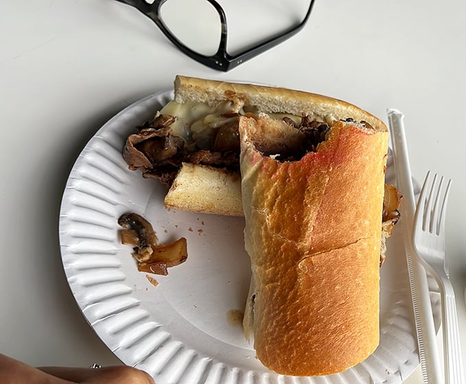 Behold the star of the show! Thinly sliced ribeye piled high with perfectly melted cheese—this isn't just a sandwich, it's an edible work of art.