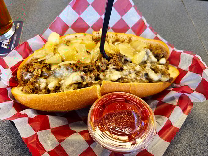 Behold the holy grail of Philadelphia cuisine—ribbons of beef embraced by melted cheese, all nestled in a perfectly crusty roll. Poetry in sandwich form.