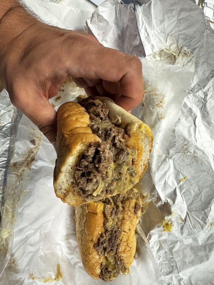 Behold the star of the show! Thinly sliced rib-eye nestled in a perfect roll—this isn't just a sandwich, it's edible architecture.