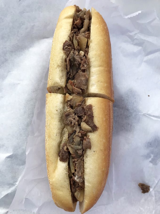 Behold the star of the show – thinly sliced steak and sautéed onions on a perfect roll. No filters needed for this kind of beauty.