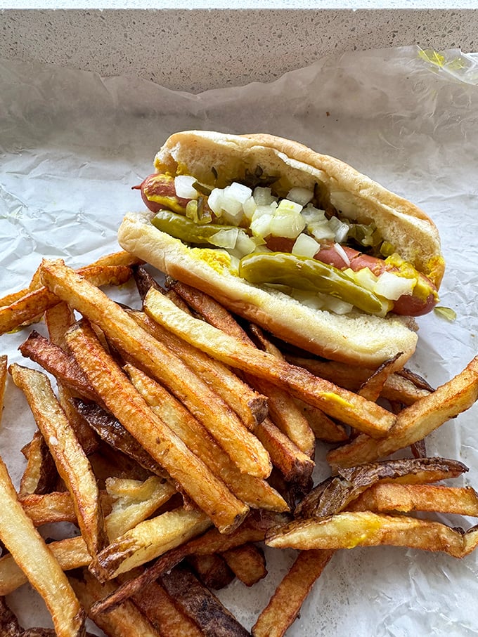 This isn't just a hot dog—it's Chicago heritage wrapped in paper. The fries aren't a side; they're part of the experience.