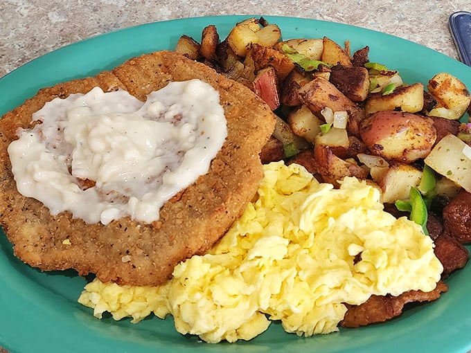 Country fried steak that could make a vegetarian reconsider their life choices, topped with gravy that deserves its own fan club.