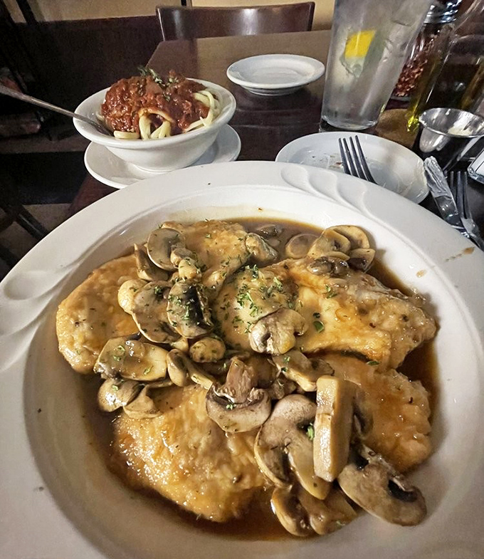 Behold the legendary Chicken Marsala – tender cutlets swimming in a mushroom-laden sauce so good you'll want to bottle it and use it as cologne.