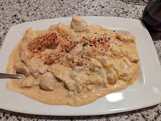 The legendary chicken paprikash—where creamy meets tangy in a dance so perfect you'll want to applaud between bites.