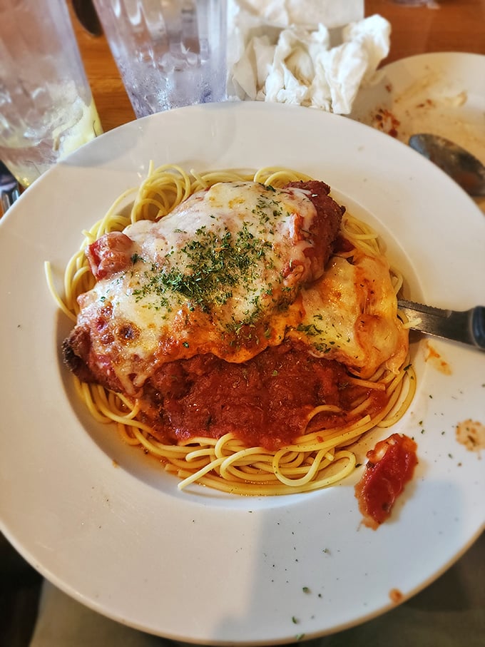 The legendary chicken parm in all its glory – where melted cheese meets marinara in a romance so perfect it should have its own reality show.