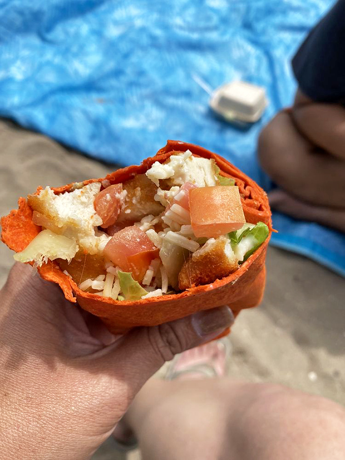 This isn't your sad desk lunch wrap. Vibrant veggies and tender chicken nestled in a sunset-colored tortilla – beach dining that doesn't sacrifice flavor for portability.