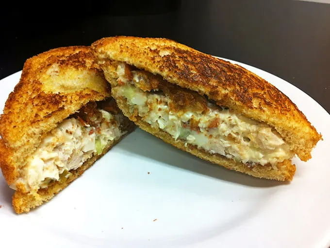 Not all heroes wear capes—some come on toasted bread with the perfect chicken salad-to-crunch ratio that'll make your lunch hour legendary.