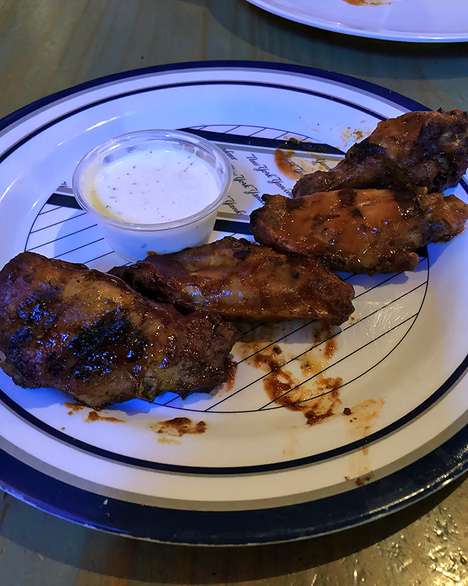 These wings aren't just cooked, they're transformed—smoke-kissed, sauce-lacquered, and served with a side of "where have you been all my life?"
