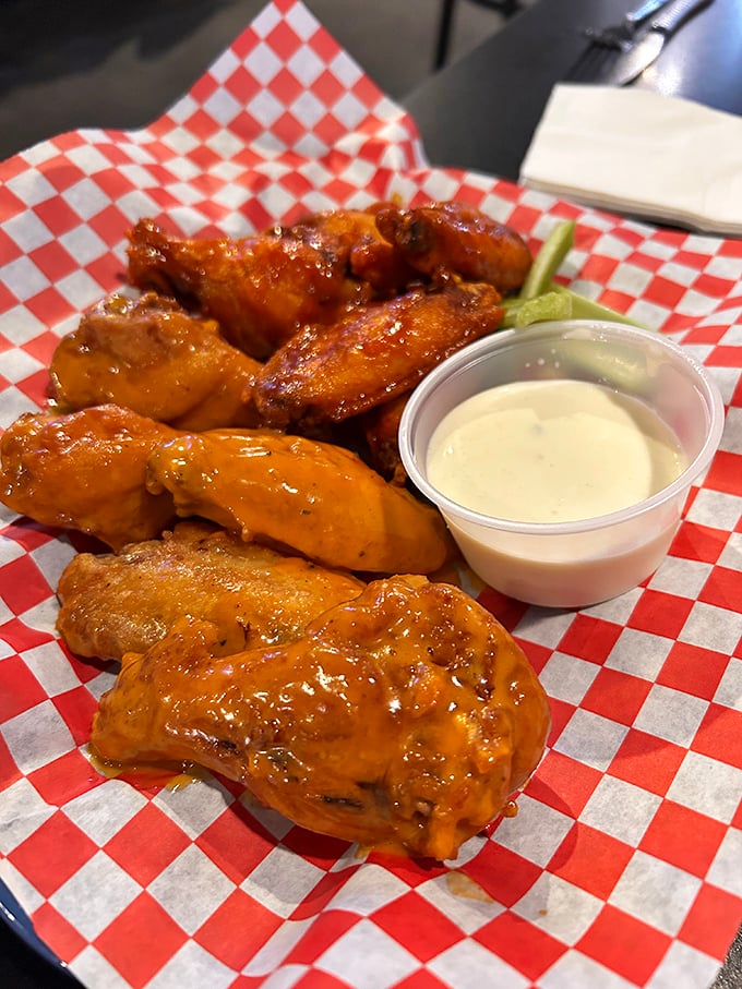 Wings that make grown adults forget table manners. Glistening with sauce, perfectly crisp outside, juicy inside—these aren't just wings, they're life-affirming experiences.