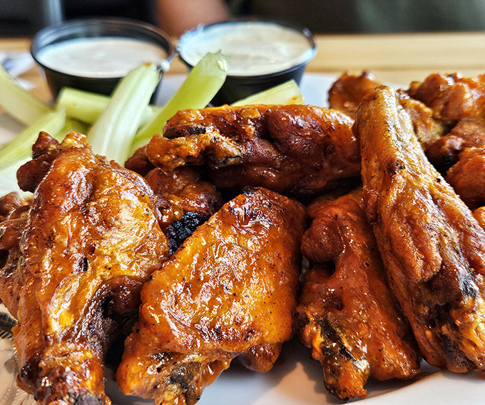 These wings aren't just crispy—they're having an out-of-body experience. Perfectly lacquered with sauce and accompanied by cooling dips, they're worth crossing state lines for.