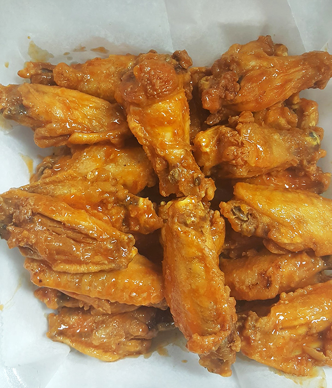 Wing perfection isn't complicated—just perfectly crispy, generously sauced, and meaty enough to make you question everything you thought you knew about chicken anatomy.