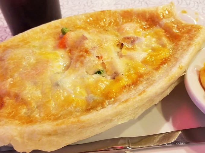 The legendary chicken pot pie in all its golden-crusted glory. This isn't just comfort food—it's a warm hug from your grandmother in edible form.
