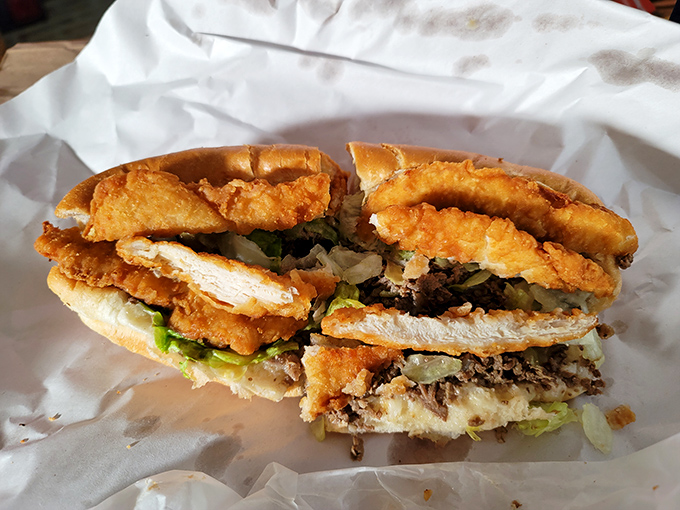Crispy chicken perfection nestled in a fresh roll – proof that sometimes the simplest pleasures deliver the most profound satisfaction.