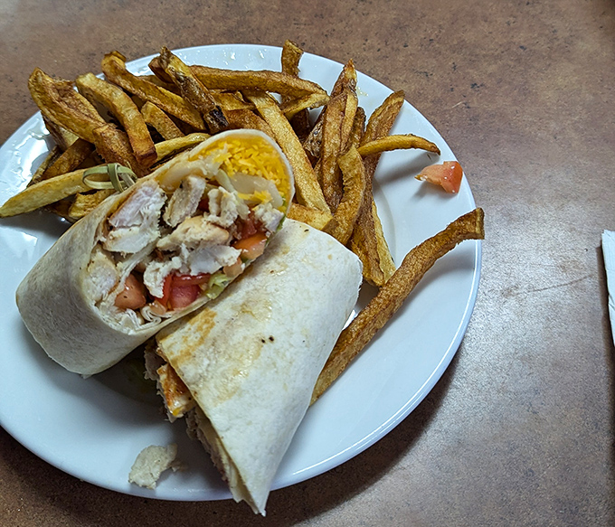 Behold, the legendary chicken wrap that launched a thousand road trips. Perfectly grilled chicken, fresh veggies, and that mysteriously addictive sauce.