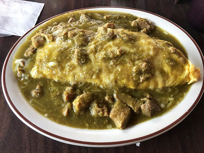 This Chile Verde Omelet isn't just breakfast, it's an edible hug—tender pork swimming in green sauce atop perfectly folded eggs that would make any morning magnificent.
