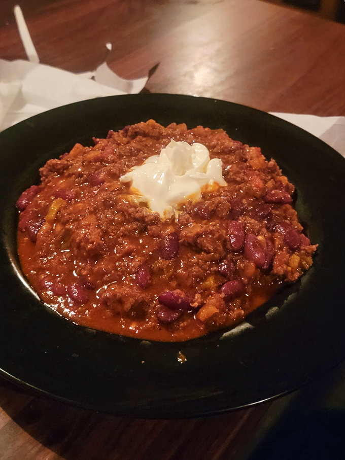 Behold: the chili that launched a thousand return visits. That dollop of sour cream isn't garnish—it's the perfect dance partner.