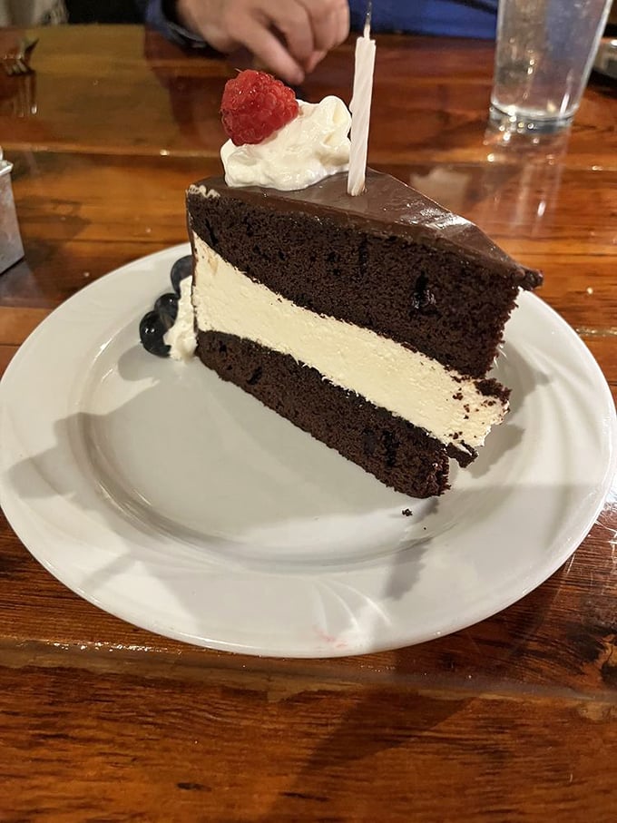 The legendary chocolate cake that launches road trips. That cream layer isn't just filling—it's the reason GPS systems across Ohio are set to "La Tavola."