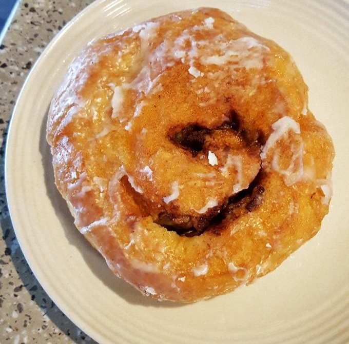 Behold the holy grail of breakfast indulgence—a cinnamon roll that makes you question why you ever settled for those mall food court imposters.