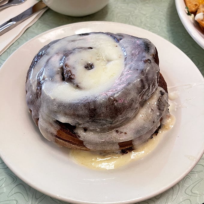 This isn't just a cinnamon roll—it's a spiritual experience. The Ooey Gooey Cinna-Biscuit glistens with glaze that cascades down its pillowy swirls.