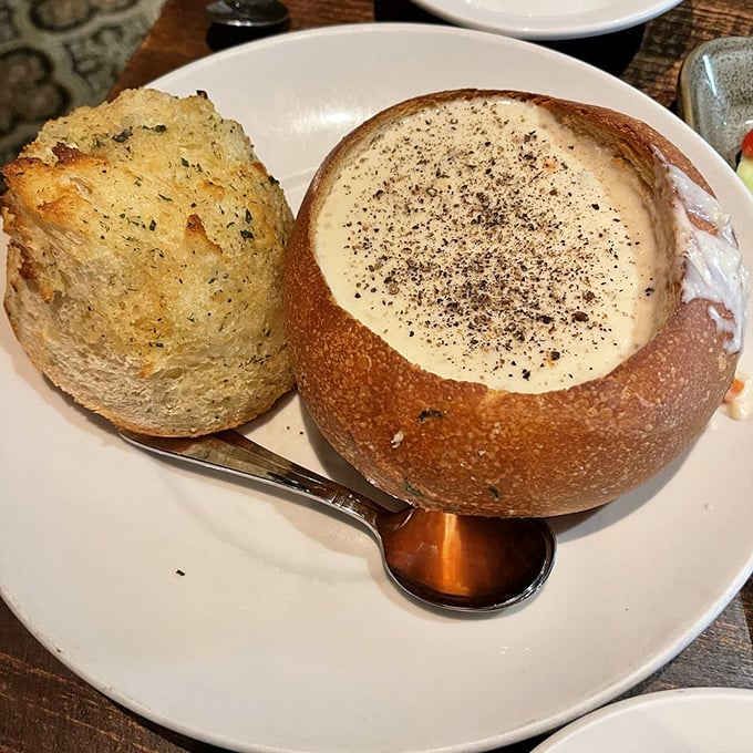 The legendary clam chowder arrives like creamy treasure in its sourdough bread bowl fortress – a California interpretation that would make New Englanders question their life choices.
