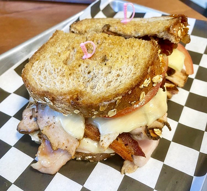 This isn't just a sandwich—it's architecture with mayo. Layers of goodness between perfectly toasted bread create the ultimate handheld masterpiece.