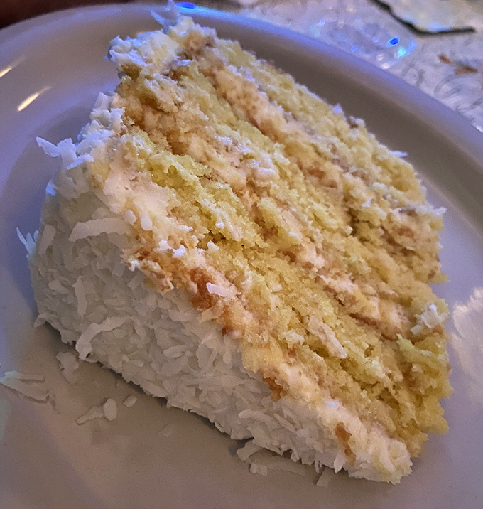 Layer upon heavenly layer of coconut bliss. This isn't just cake—it's what clouds must taste like if they were made by someone who really likes you.