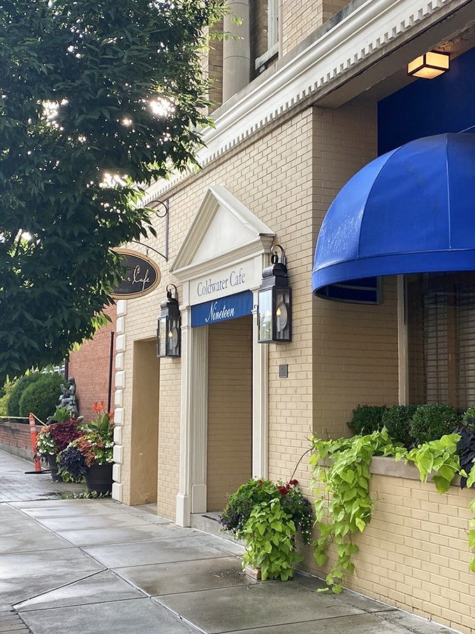 Coldwater Café's elegant entrance promises culinary delights within. The cascading greenery adds a touch of nature to this downtown gem.