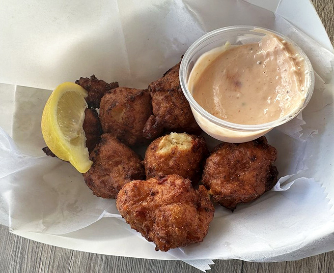 Golden-brown perfection arrives with a creamy sidekick – these conch fritters could make a mermaid jealous.